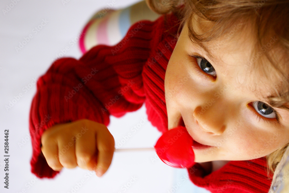 litlle girl with lollipop Stock Photo | Adobe Stock