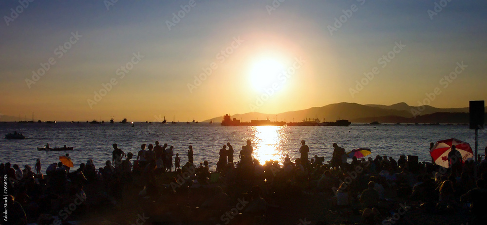 crowd and sunset at the beach Stock Photo | Adobe Stock