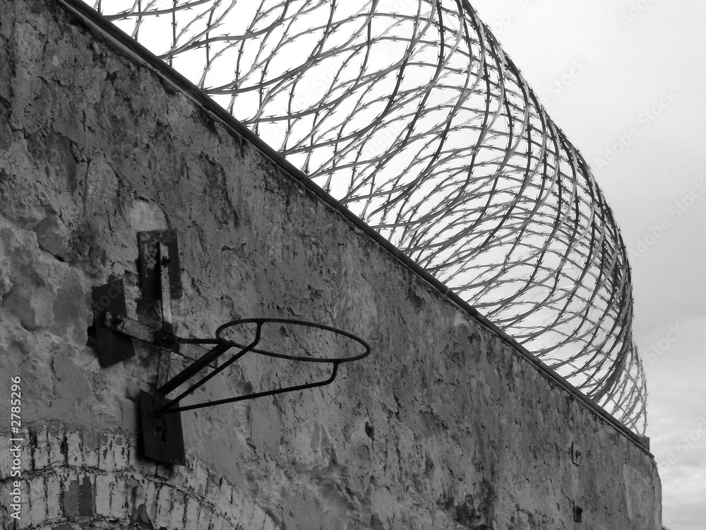 prison wall and razor wire Stock Photo | Adobe Stock