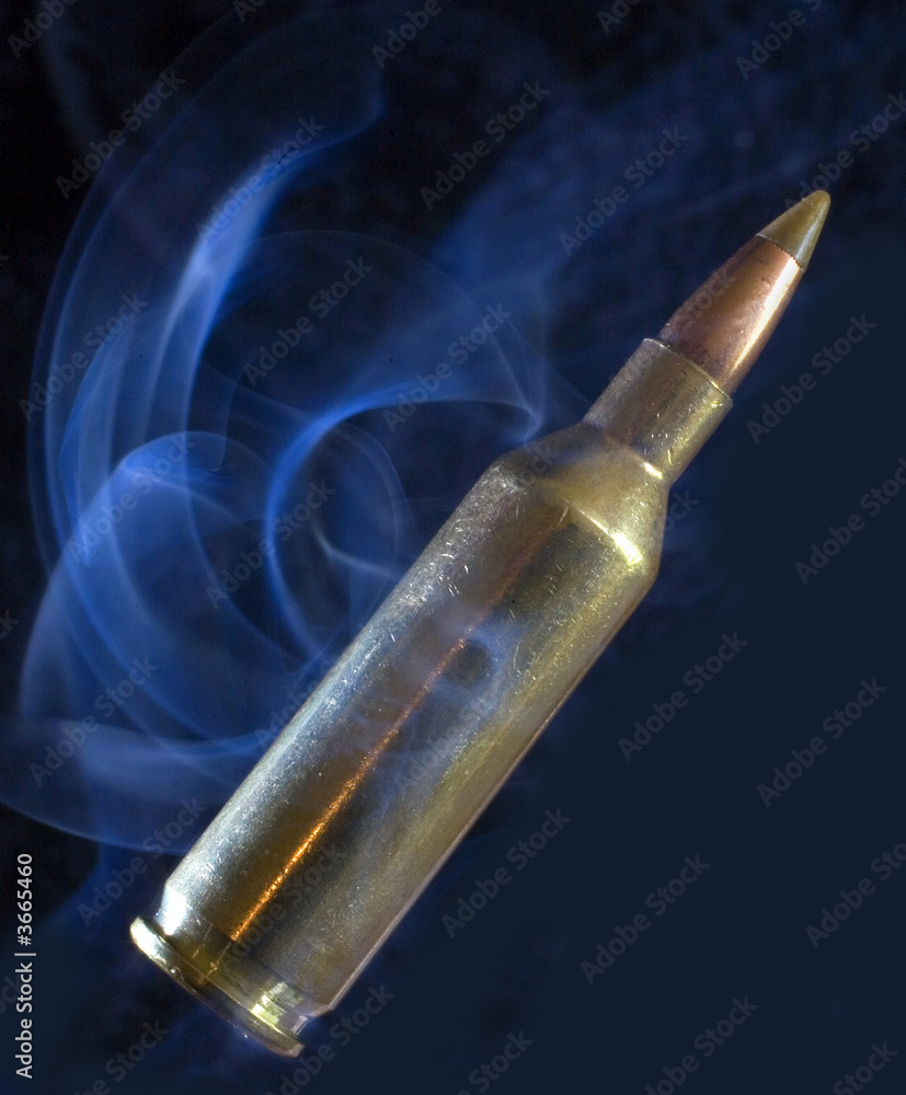 this bullet and cartridge are smoking Stock 写真 | Adobe Stock