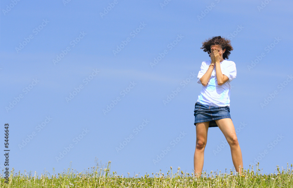 Crying teen girl against a blue sky with space for text on left Stock ...