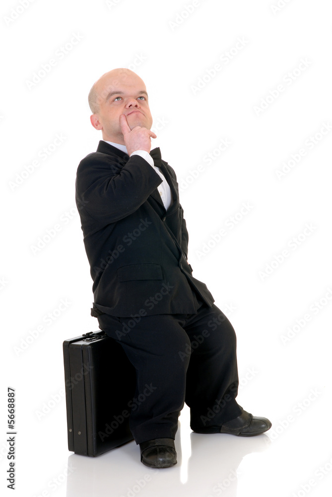 Troubled little businessman, dwarf in a formal suit Stock Photo | Adobe ...