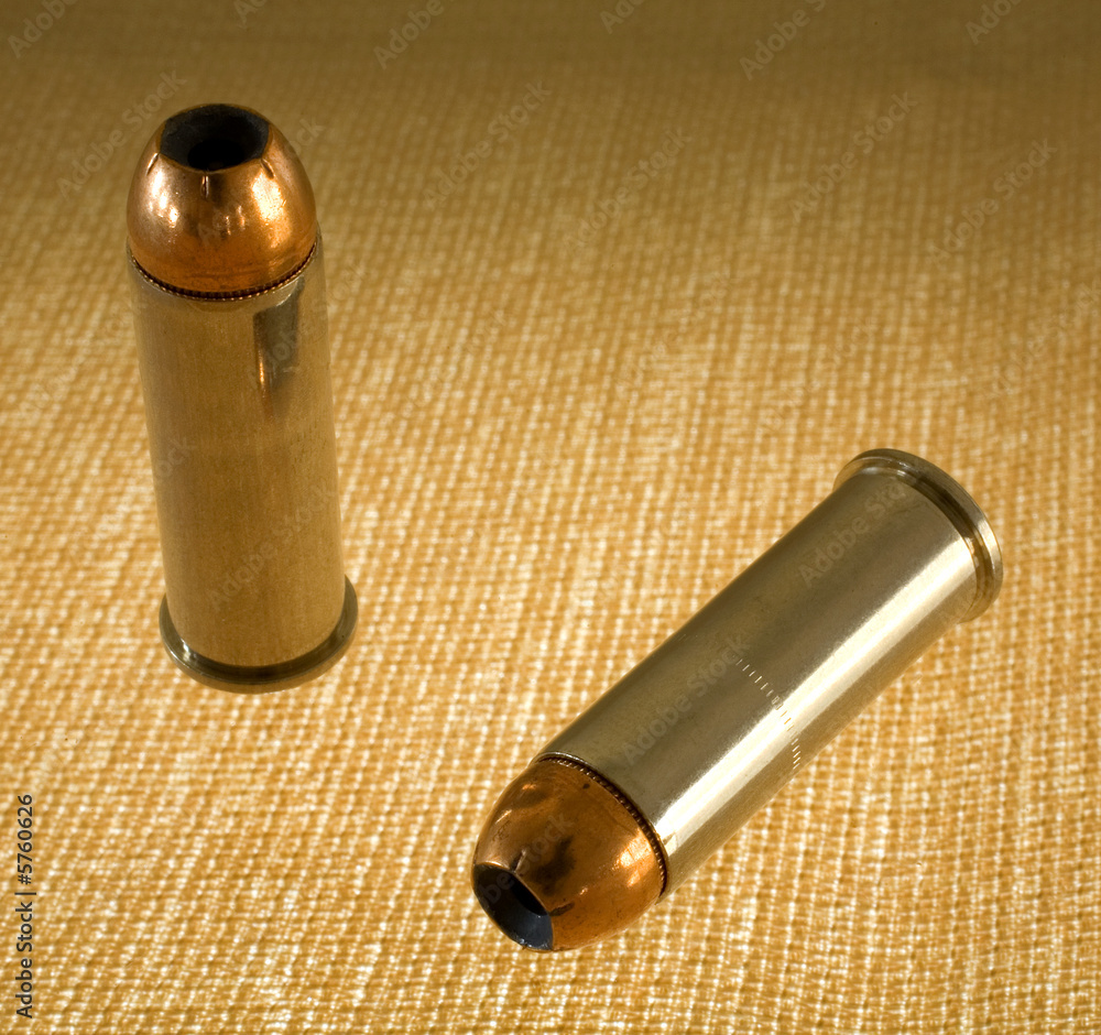 .44 Magnum cartridges with copper bullets that are backlit Stock Photo ...