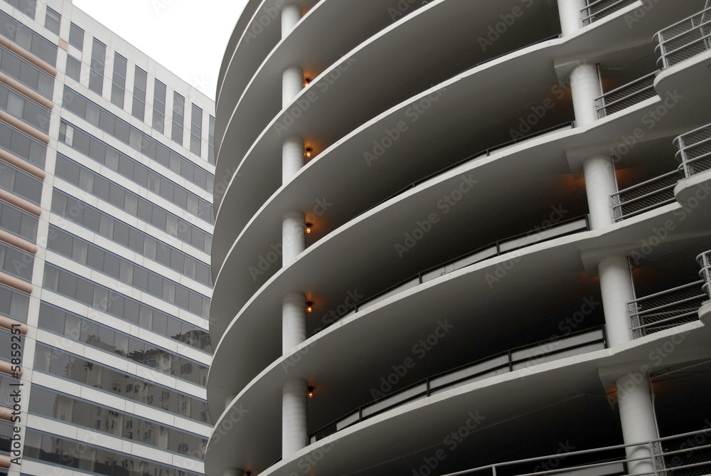 Curved concrete parking structure & generic office building Stock Photo ...