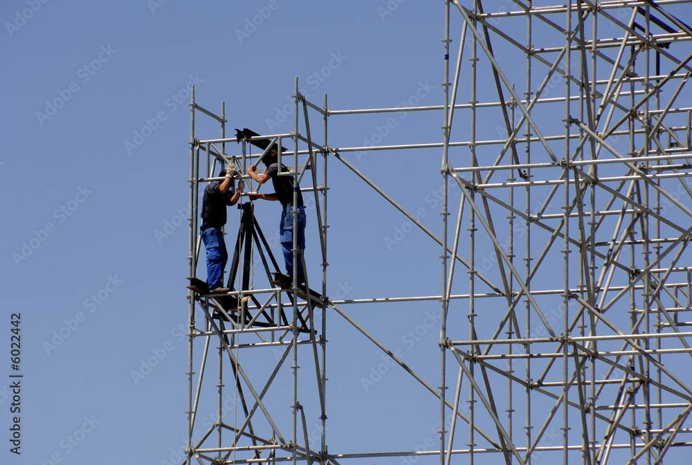 Construction workers building a new structure in city Stock Photo ...