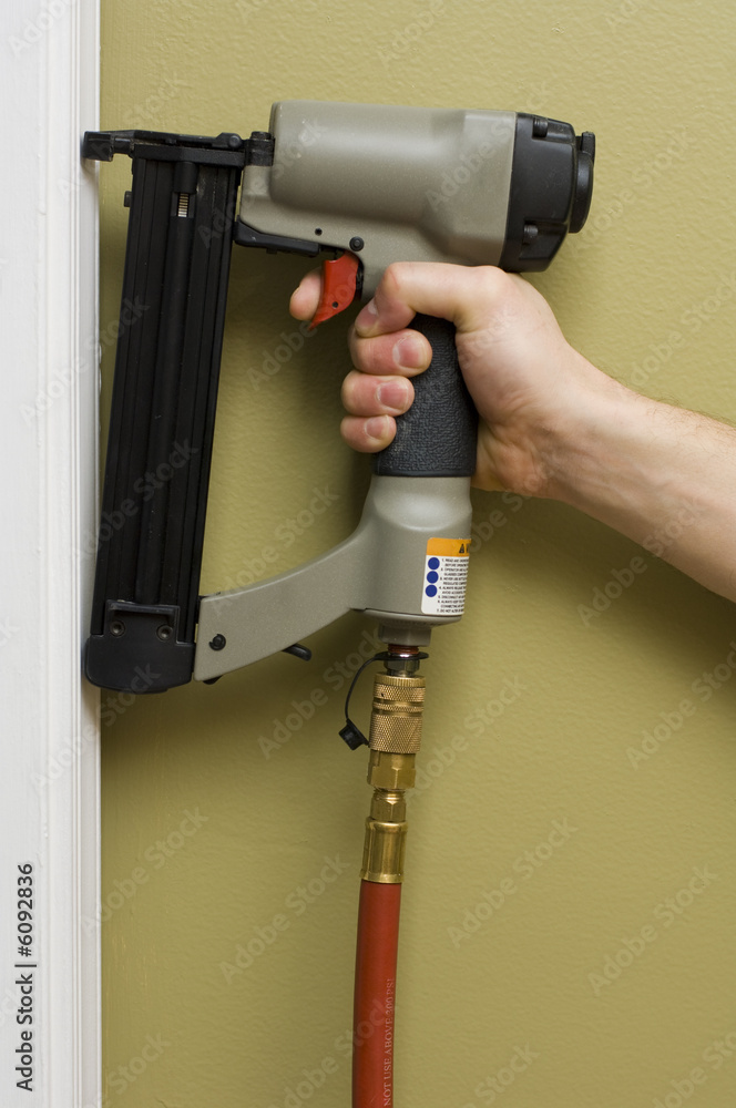 Framing with air tool nailer Stock Photo | Adobe Stock