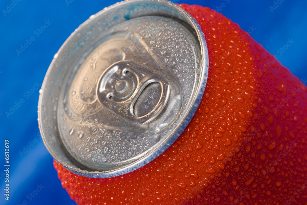 Red can of soft drink in a blue background Stock Photo | Adobe Stock