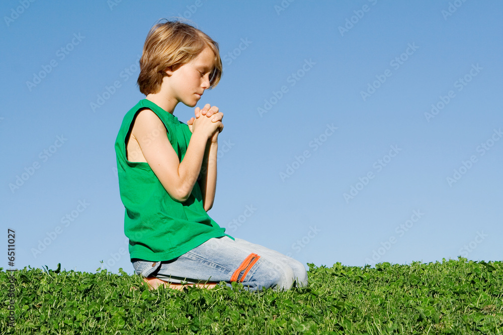 christian child kneeling praying Stock Photo | Adobe Stock