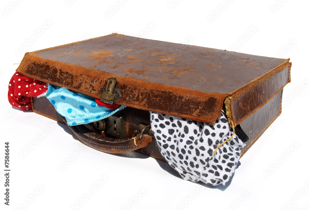 Battered old brown leather suitcase with underwear coming out th Stock ...