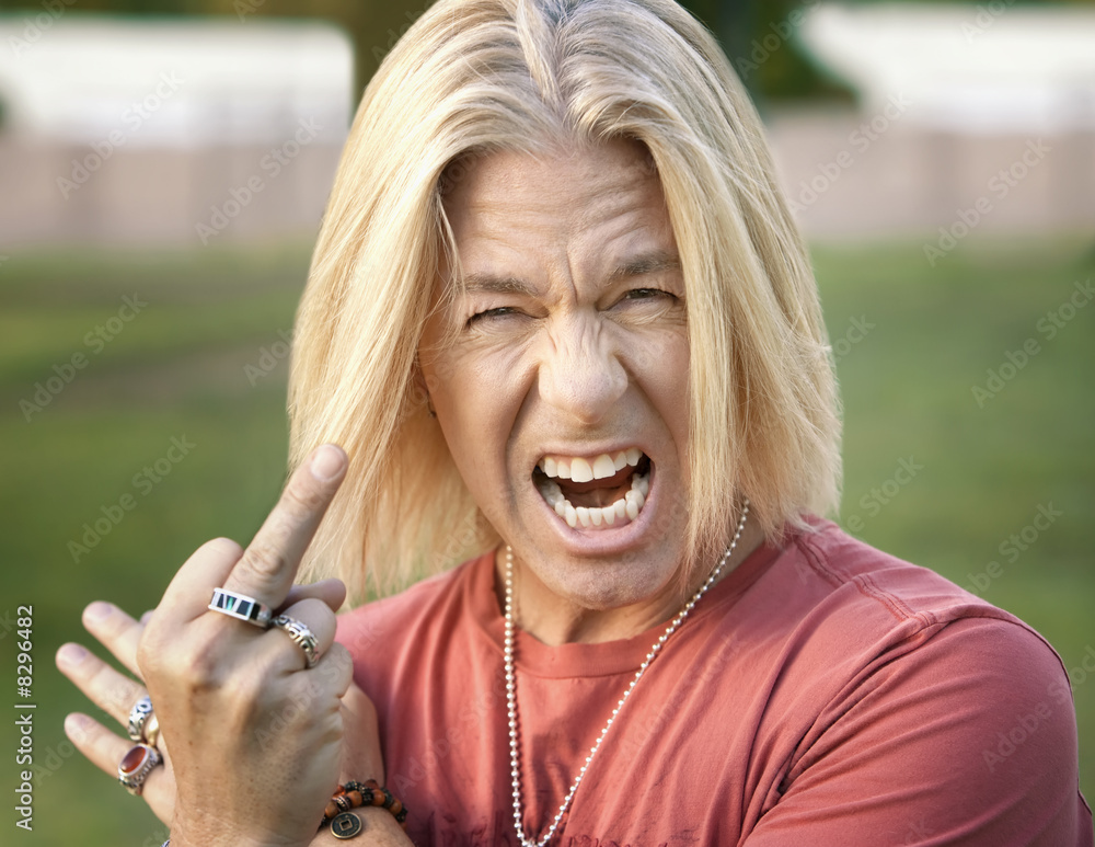 Rock and Roll Guy with his Middle Finger Extended Stock Photo | Adobe Stock