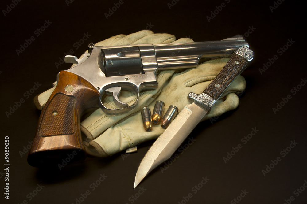 41 Magnum revolver with ammo and bowie knife Stock Photo | Adobe Stock