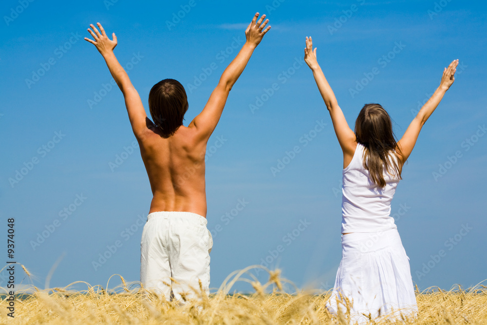 Rear view of successful people lifting their arm Stock Photo | Adobe Stock
