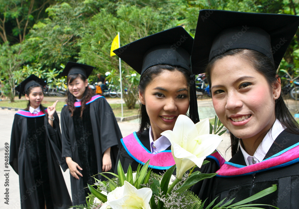 Beautiful Asian university graduates celebrate their success. Stock ...