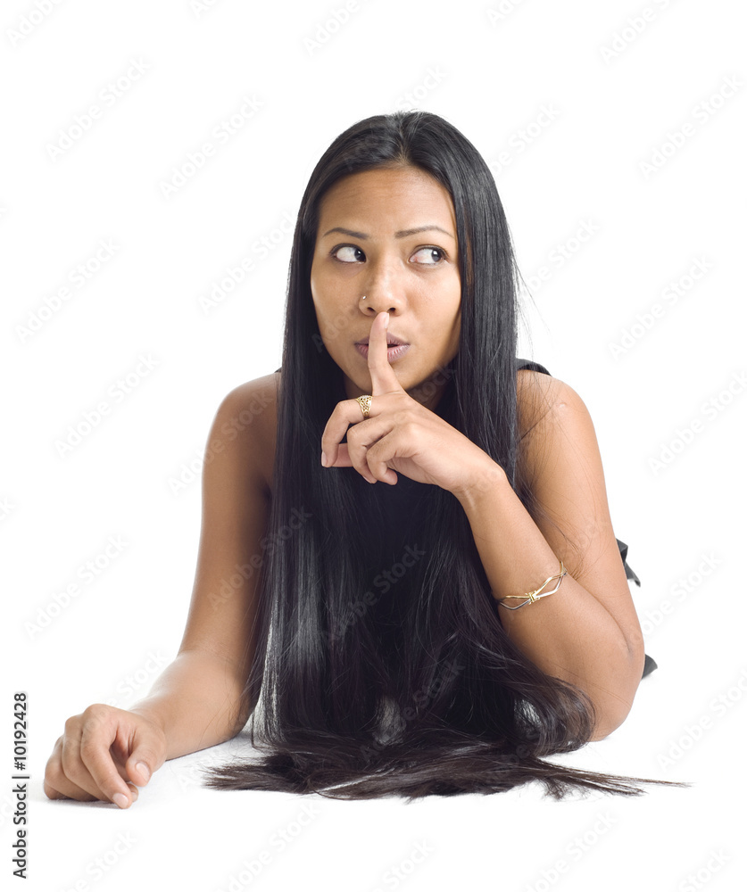 young asian with finger on her lips Stock Photo | Adobe Stock