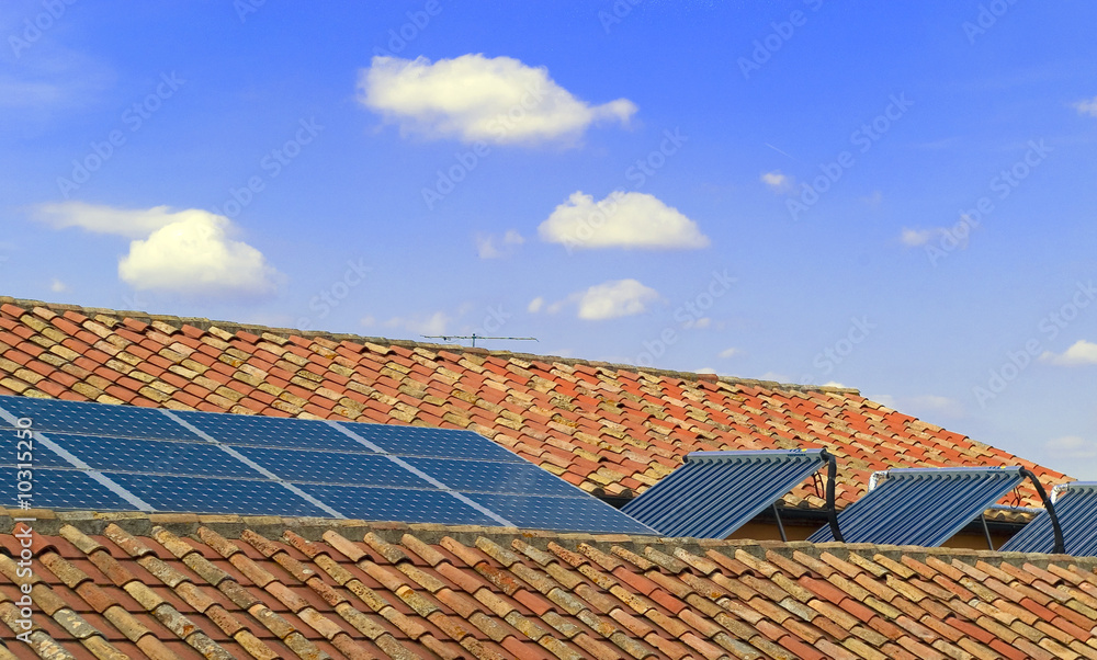 Photovoltaic rooftop solar and thermal panels Stock Photo | Adobe Stock