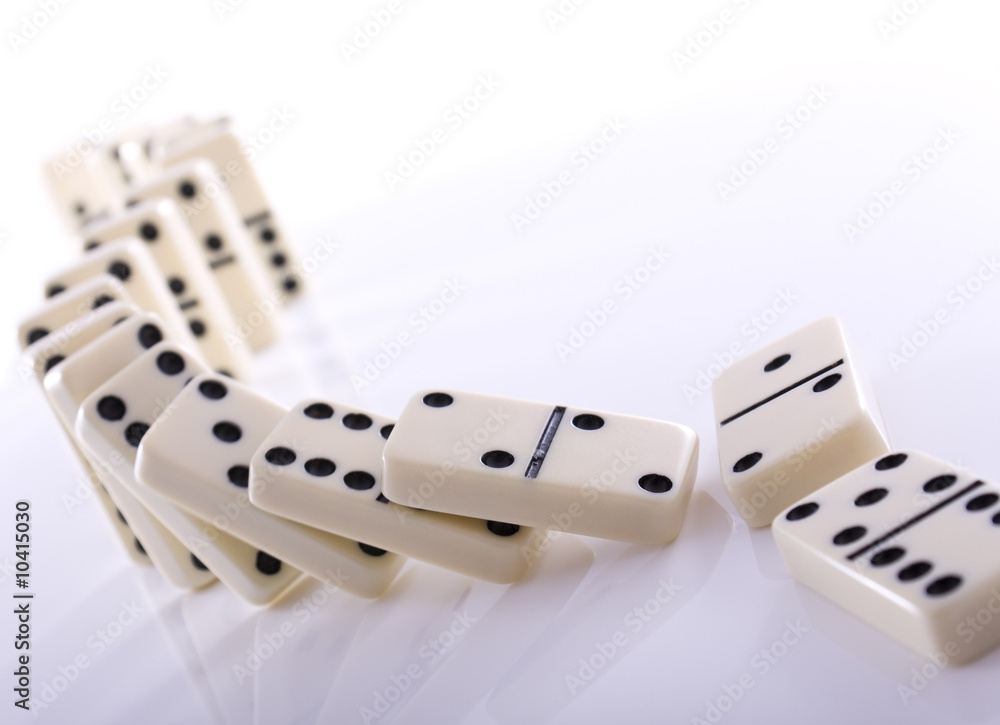 Line of dominos falling down after being pushed over Stock Photo ...