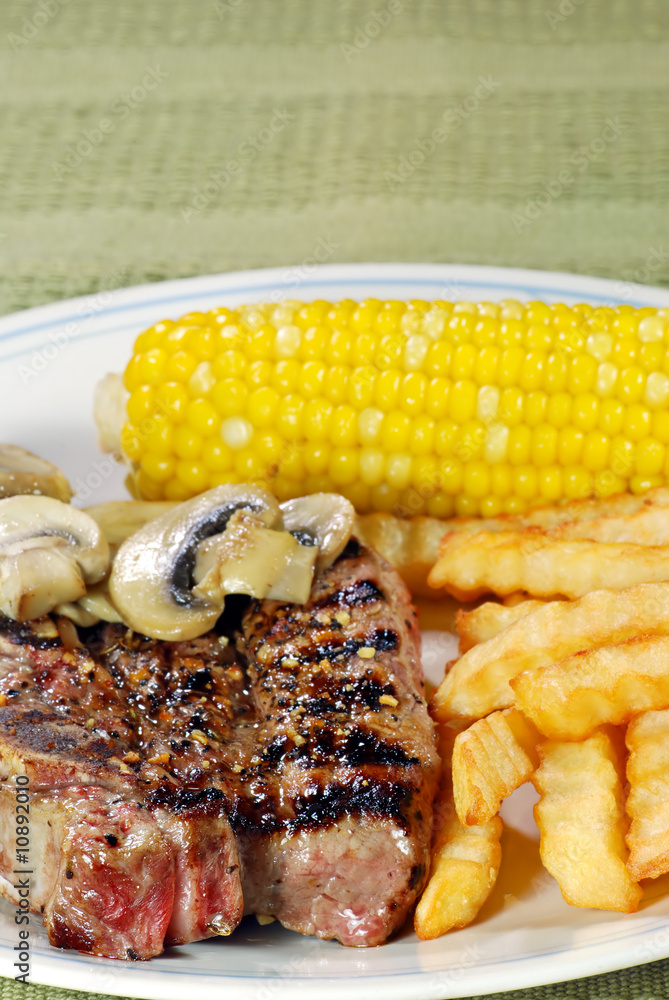 barbecue short ribs with fries and vegetables Stock Photo | Adobe Stock
