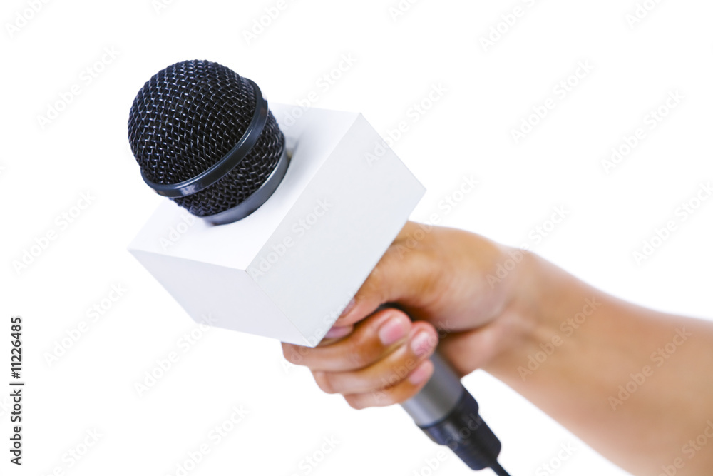 Bare hand holding microphone Stock Photo | Adobe Stock
