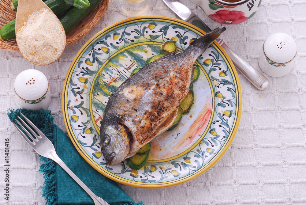 Orata con le zucchine - Secondo di pesce - Emilia Romagna Stock Photo ...