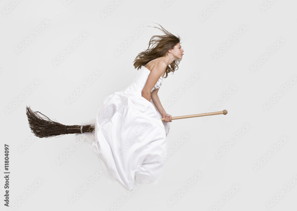 young witch on the broom on grey background for easy isolation Stock ...