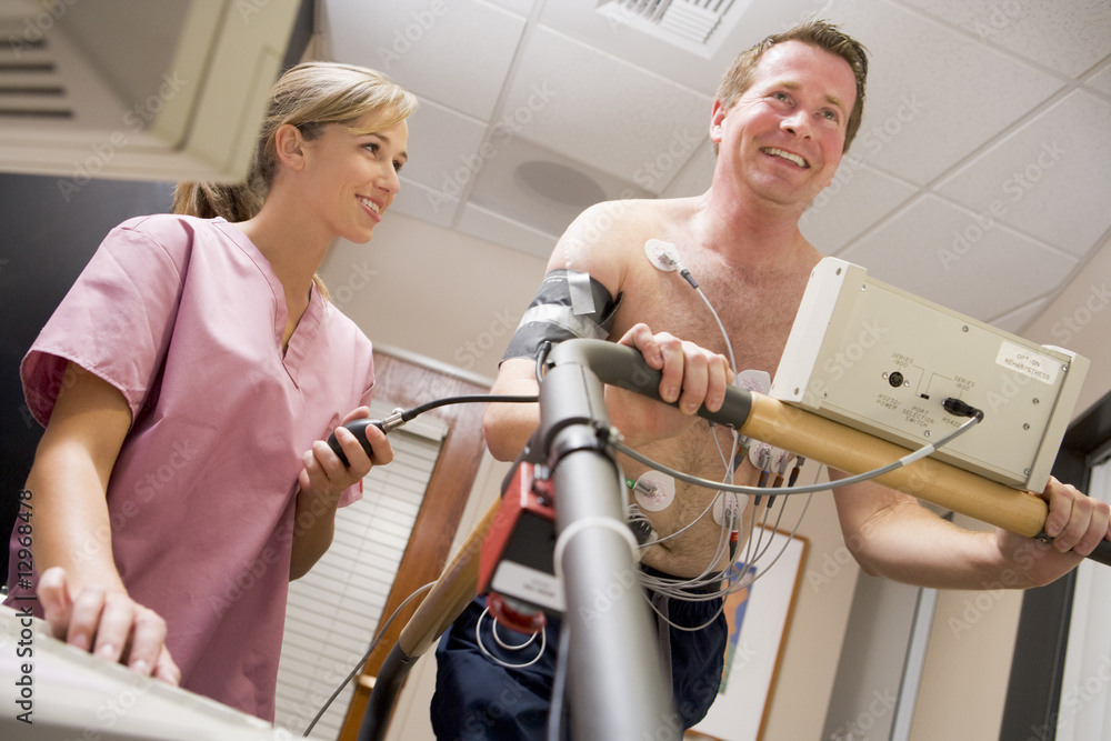Nurse With Patient During Health Check Stock Photo | Adobe Stock