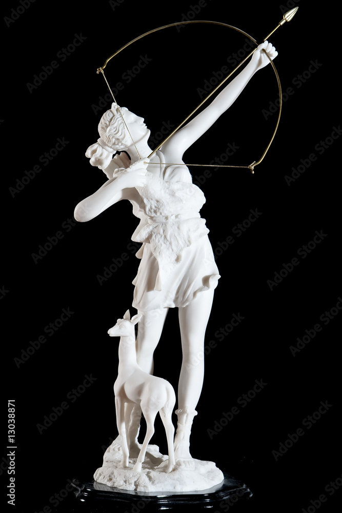 Classic white marble statuette of Artemis isolated on black ภาพถ่าย ...