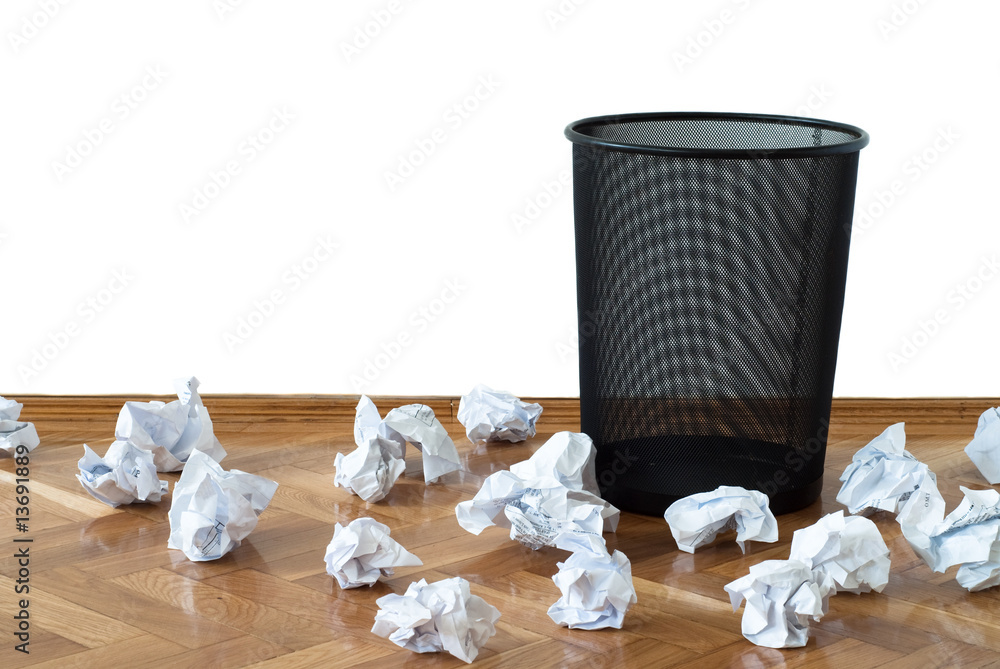 Empty wastepaper basket surrounded by crumpled documents Stock Photo ...