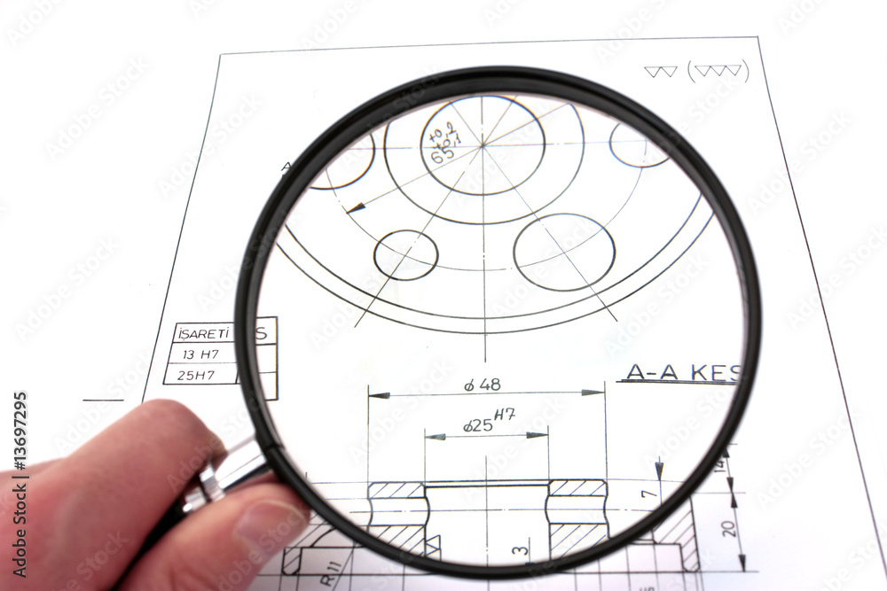 Reviewing technical drawing. Focus on technical drawing. Stock Photo ...