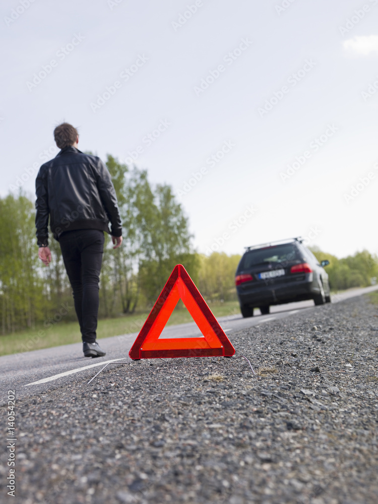 Warning triangle in front of a car breakdown Stock Photo | Adobe Stock