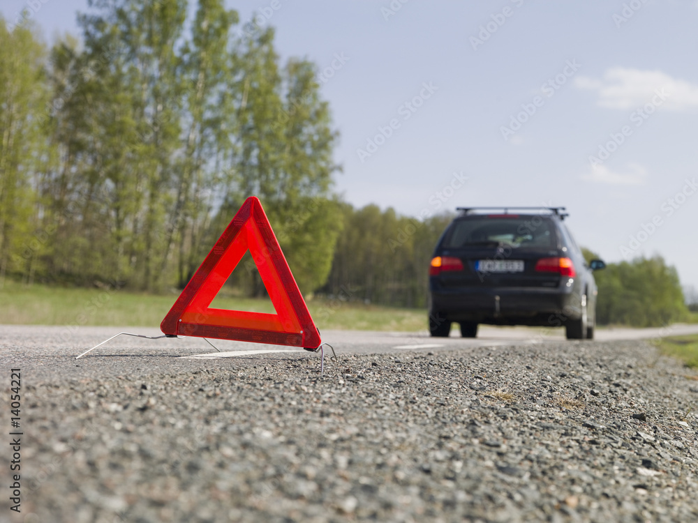 Warning triangle in front of a car breakdown Stock Photo | Adobe Stock