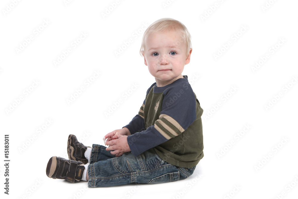 Serene Baby Boy Sitting Sideways Stock Photo | Adobe Stock