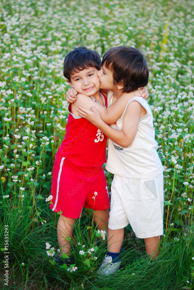 Two little brothers kissing each other Stock Photo | Adobe Stock
