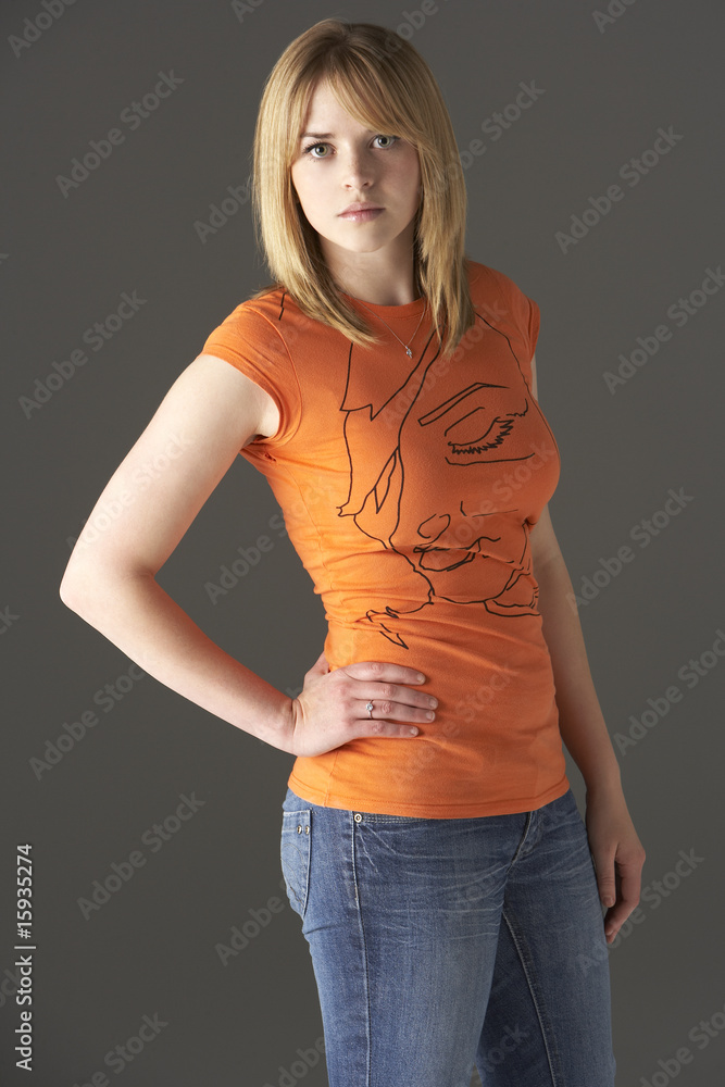 Studio Portrait Of Standing Teenage Girl Stock Photo | Adobe Stock