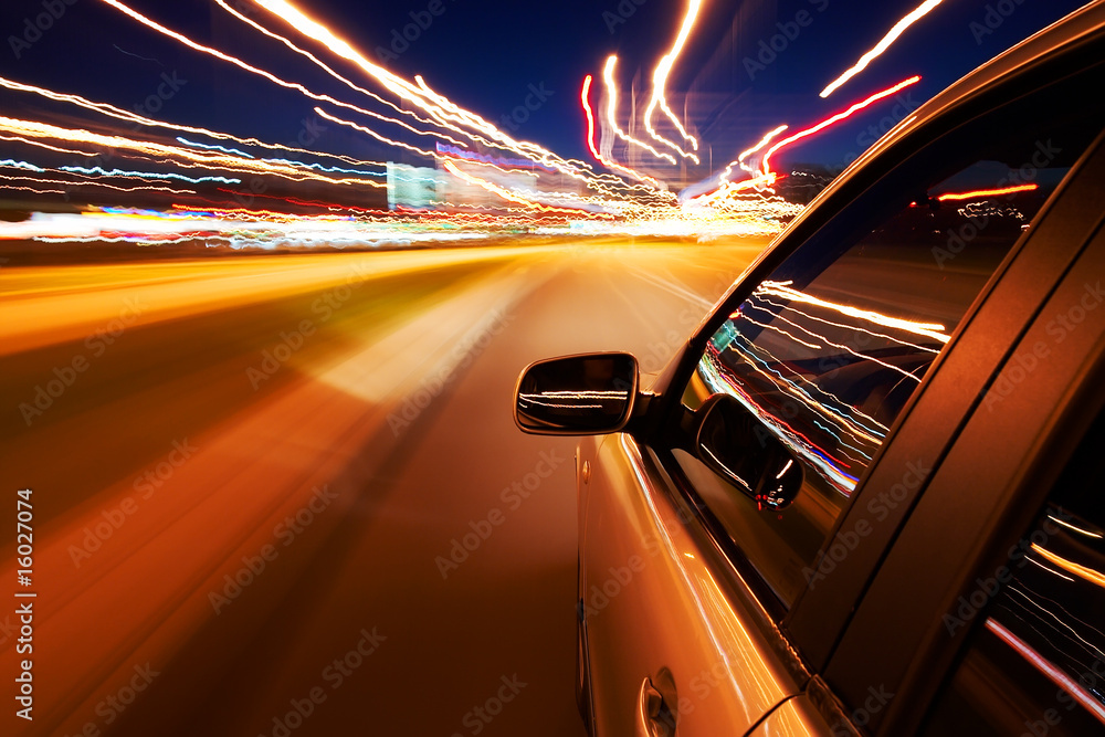 Car driving fast Stock Photo | Adobe Stock