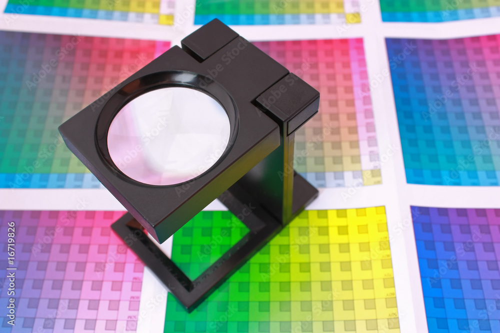 Magnifying glass on cmyk color swatch Stock Photo | Adobe Stock
