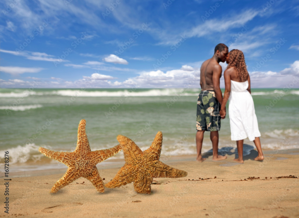 Romantic Couple Walking Into the Surf Stock Photo | Adobe Stock