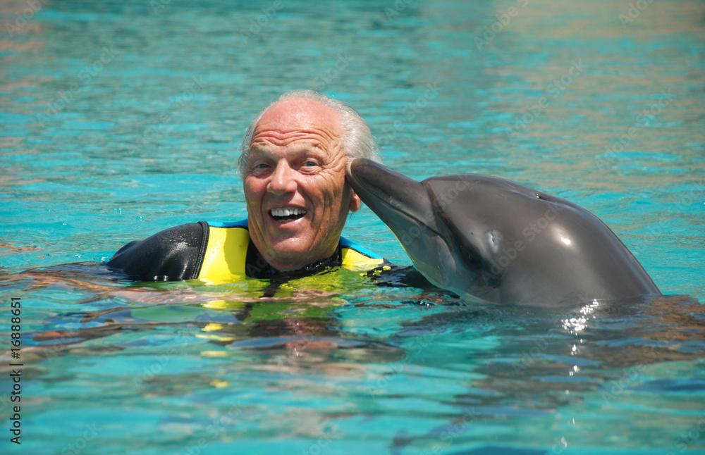 Older Men with delphin Stock Photo | Adobe Stock