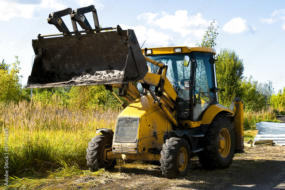 Wheel loader bulldozer with raised bucket Stock Photo | Adobe Stock