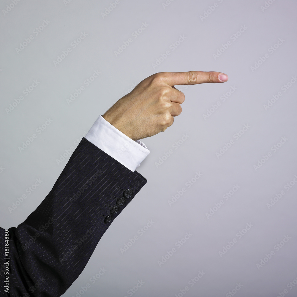 homme pointant le doigt Photos | Adobe Stock