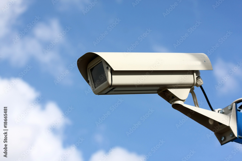 security video camera on background blue sky Stock Photo | Adobe Stock