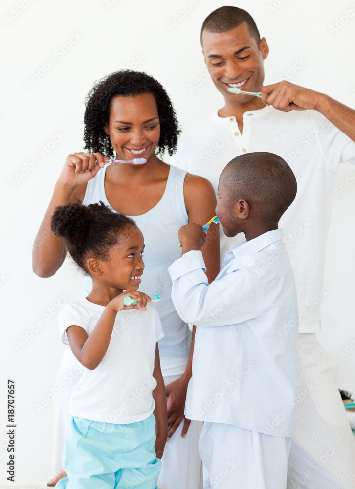 Portrait of a happy family brushing their teeth together Stock Photo ...