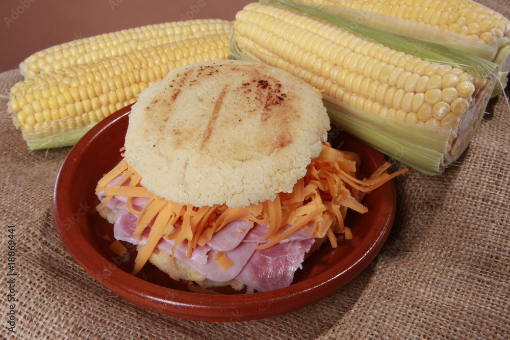 Arepa hamon y queso - Latino cheddar and ham corn patty Stock Photo ...