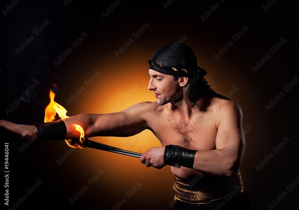 Handsome men performing fire show Stock Photo | Adobe Stock