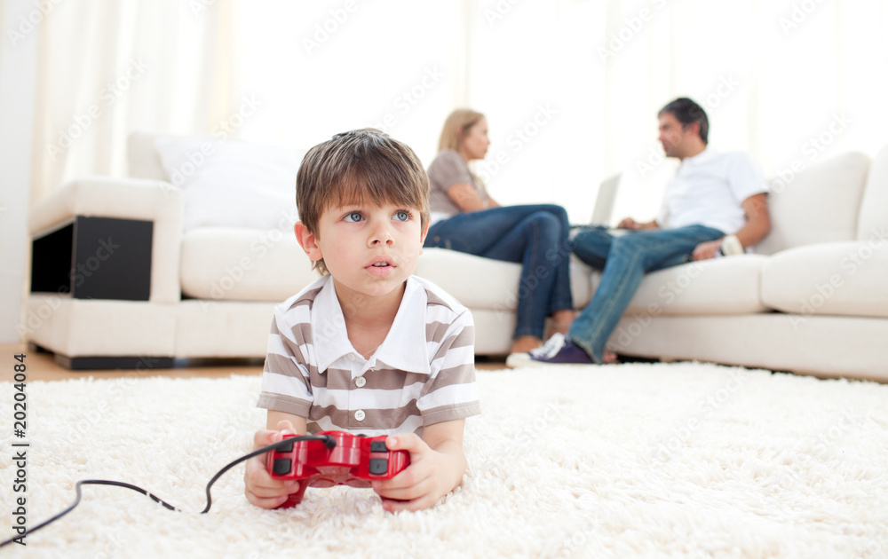 Cute little boy playing video games Stock Photo | Adobe Stock