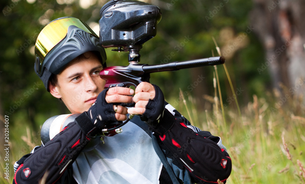 paintball shooter aiming the gun Stock Photo | Adobe Stock