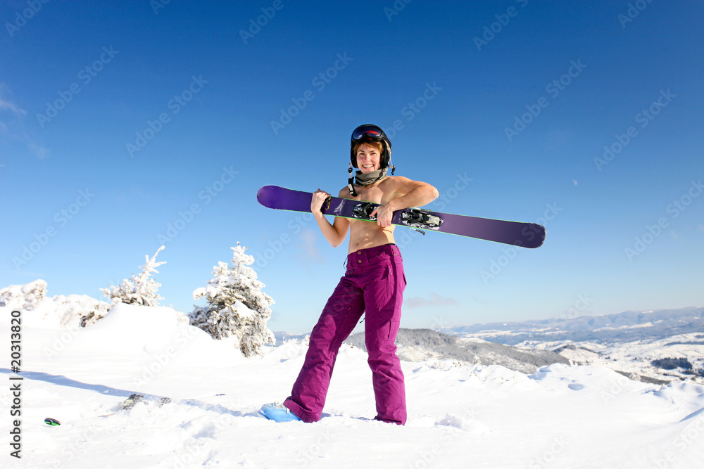 Female skier topless with a ski standing on the heel foto de Stock ...
