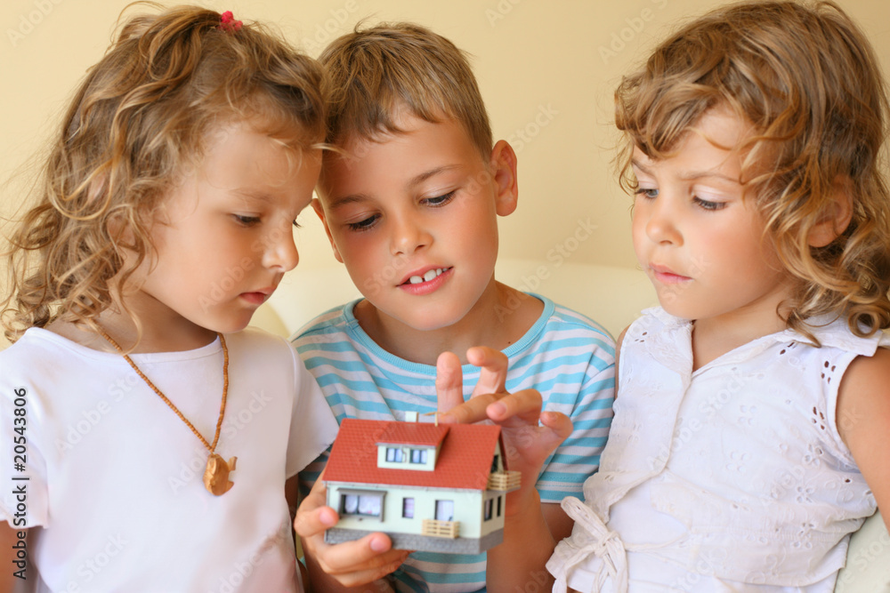 children three together keeping in hands model of house Stock Photo ...