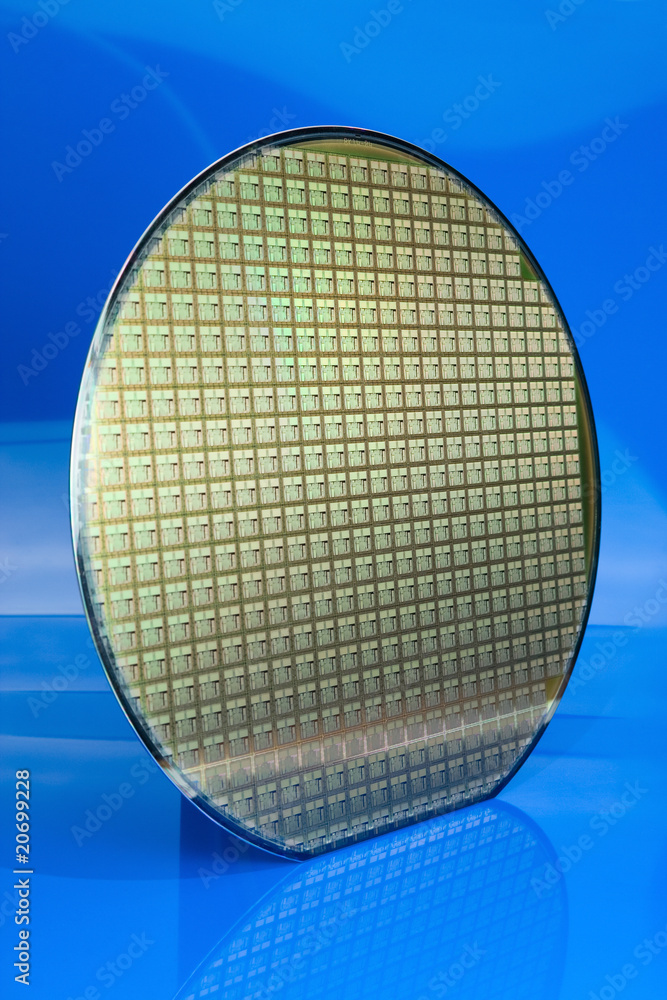 Silicon wafer on blue background Stock Photo | Adobe Stock