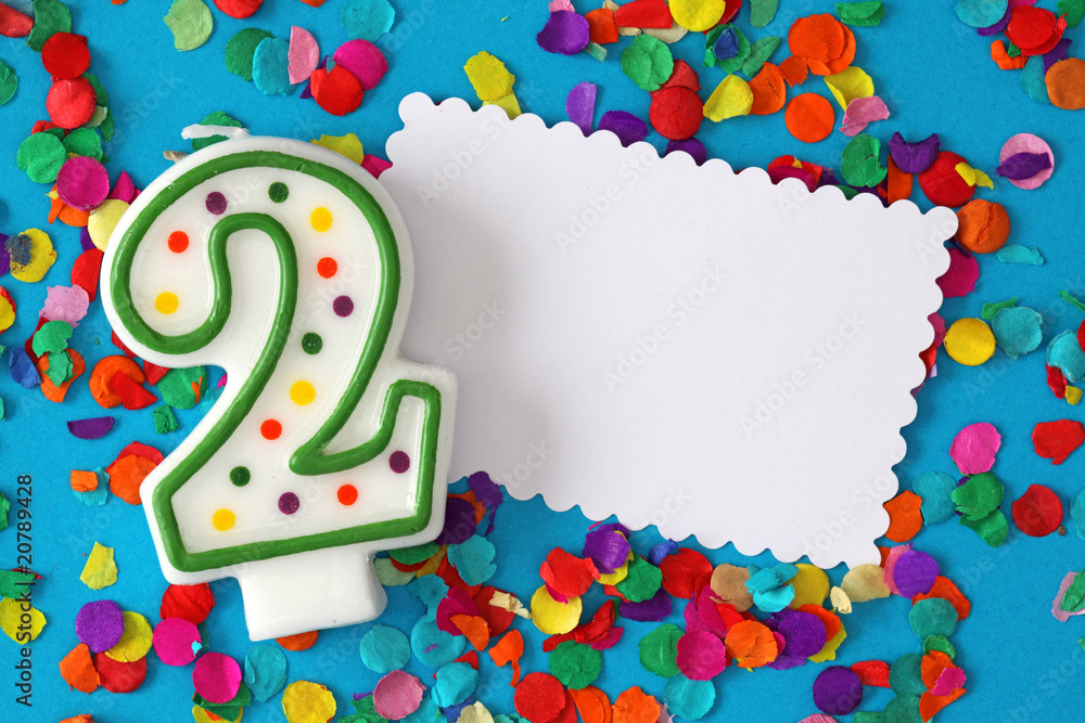 Number two birthday candle on blue background Stock Photo | Adobe Stock