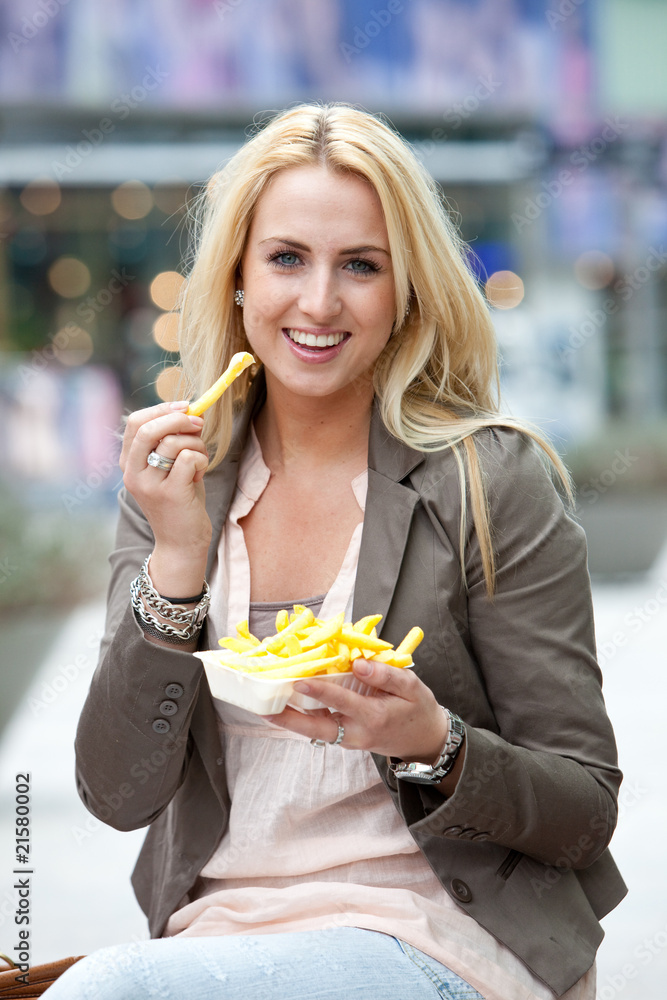 Eating fries Stock Photo | Adobe Stock